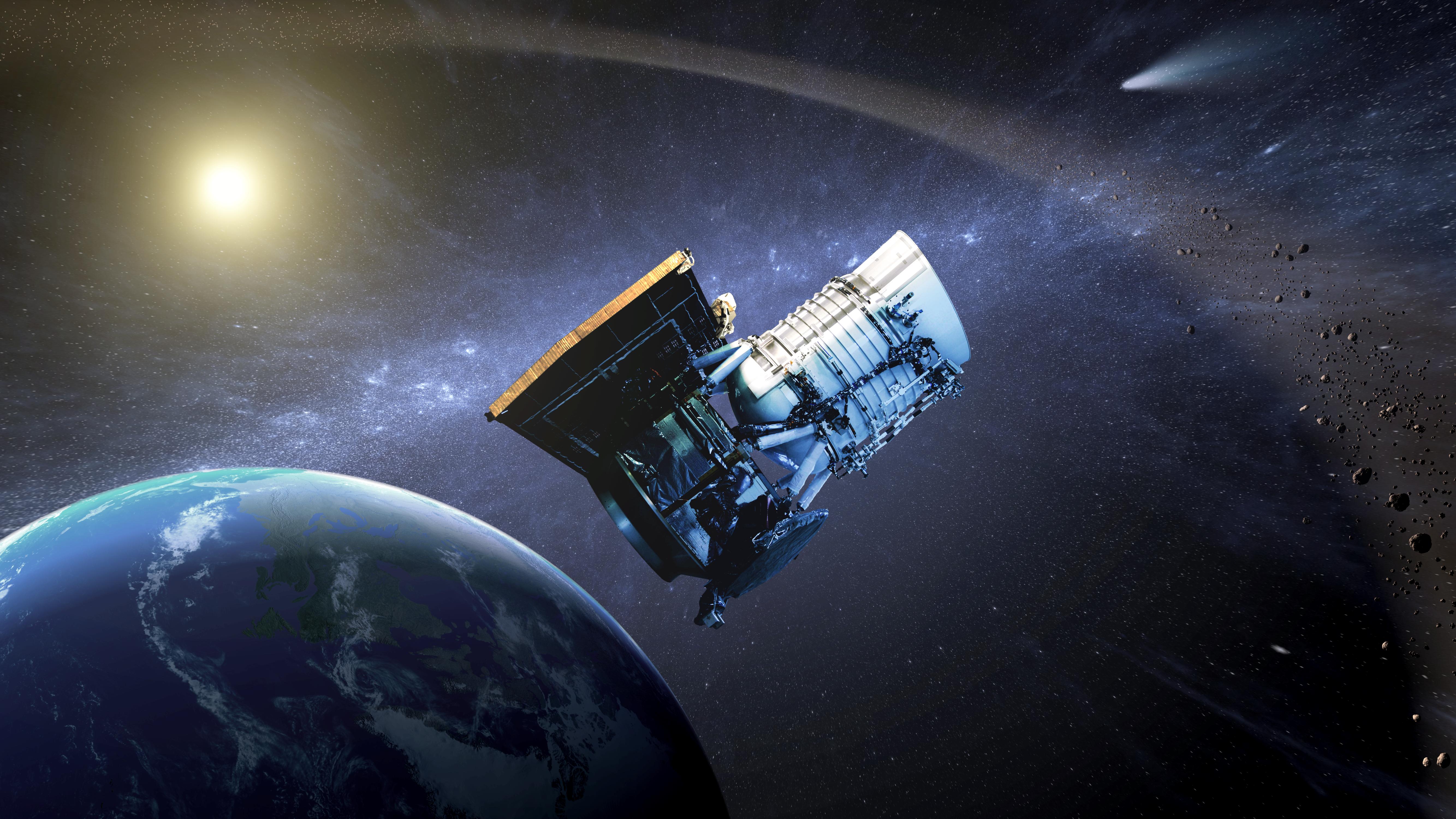 This artist's concept shows WISE in its orbit around Earth. Credit ...